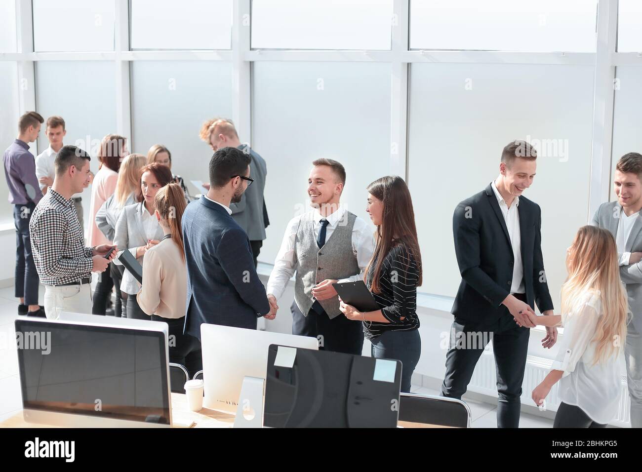 Young employees discussing work hi-res stock photography and images - Alamy