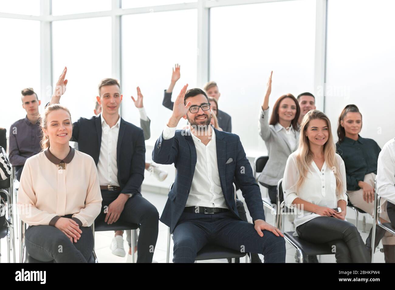 Young employees ask questions hi-res stock photography and images - Alamy