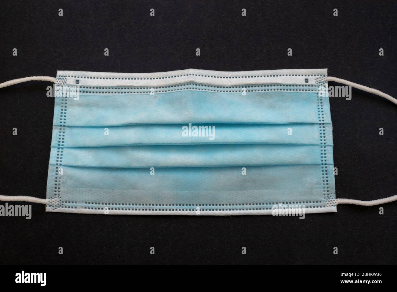 Surgical mask with rubber ear straps. Typical 3-ply surgical mask ...