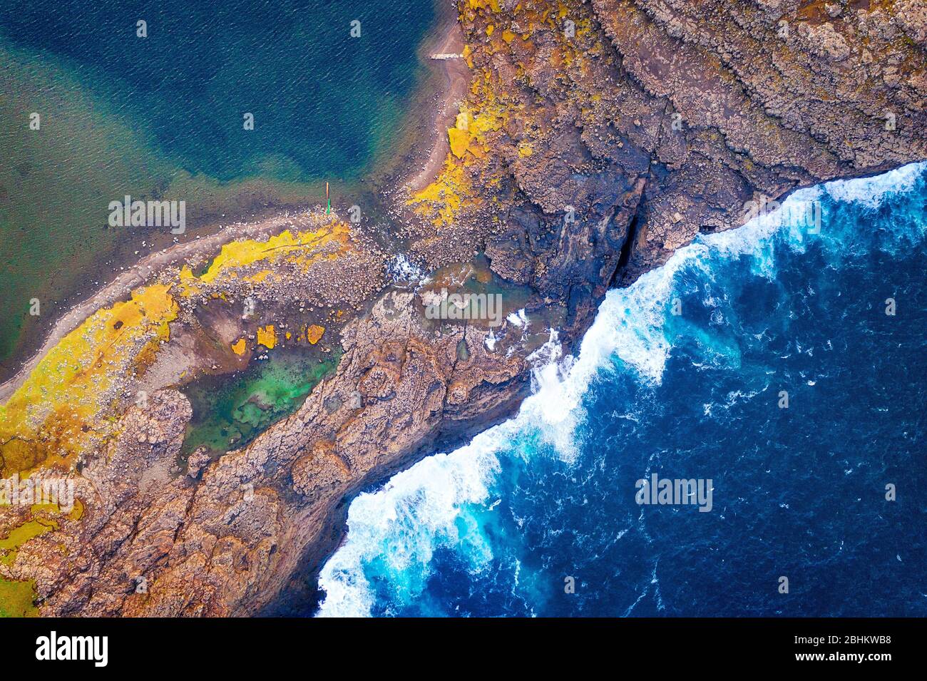 Top Down cliffs and coast line with waves breaking, post processed in ...