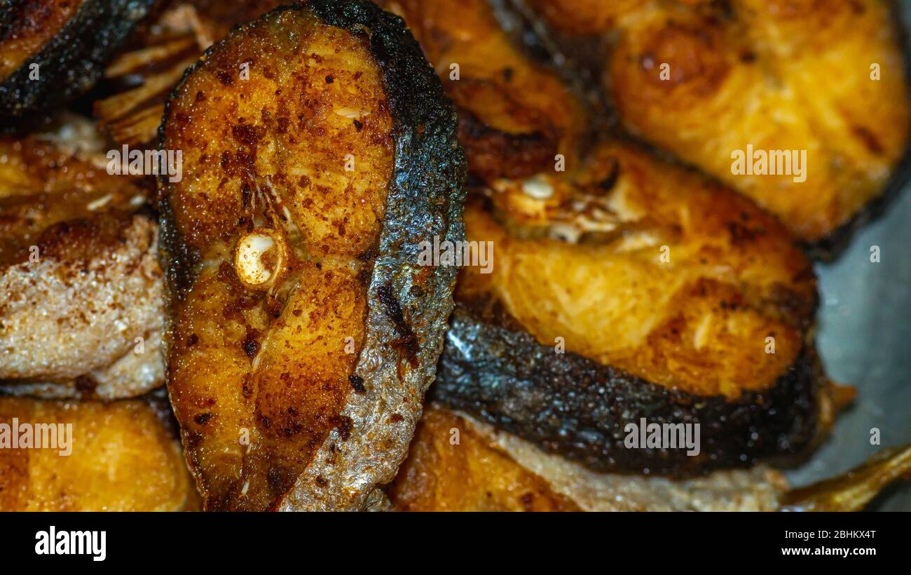 Slices of fried Pangasius fish Stock Photo - Alamy