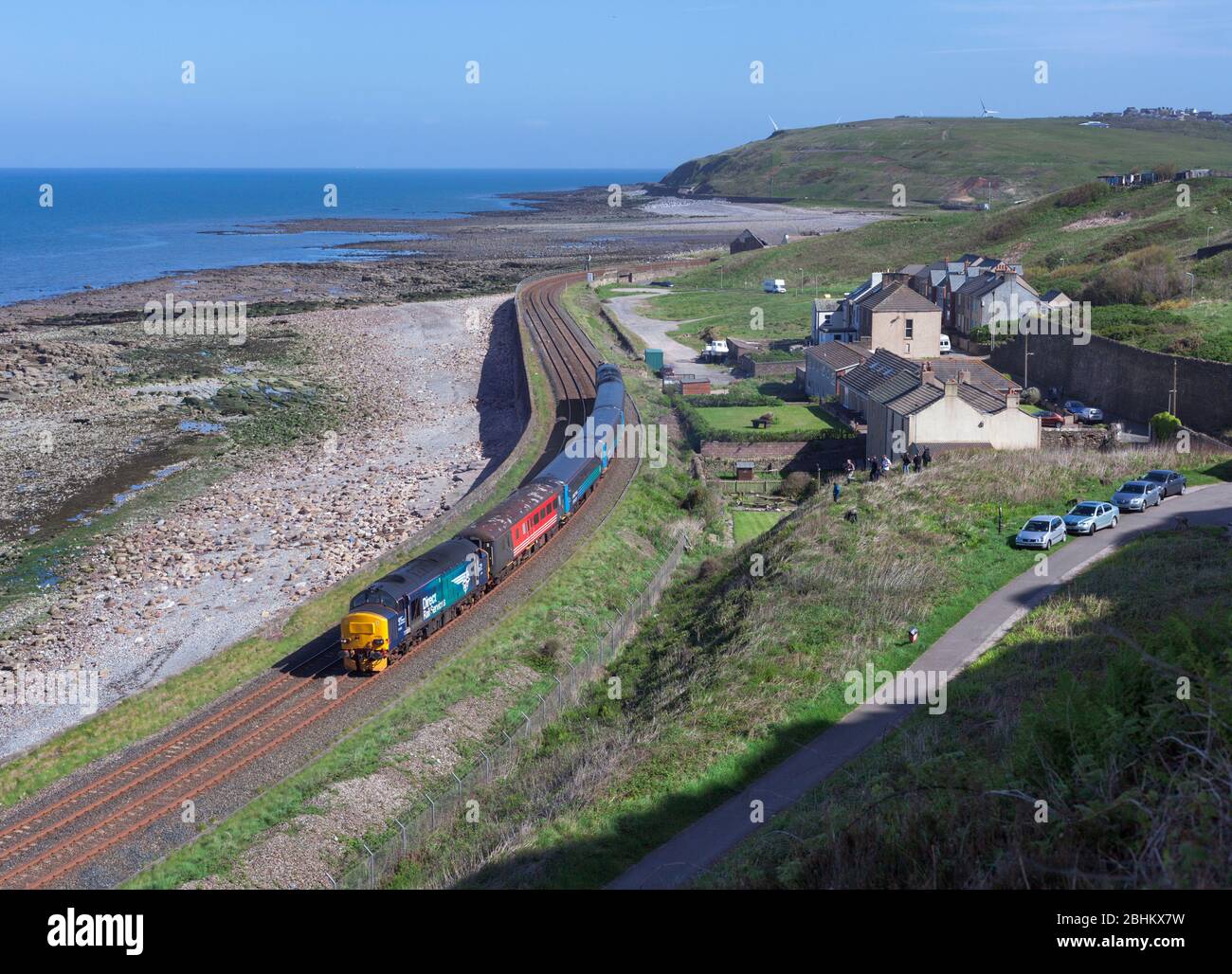 Direct Rail Services class 37 with a Northern rail train running along ...