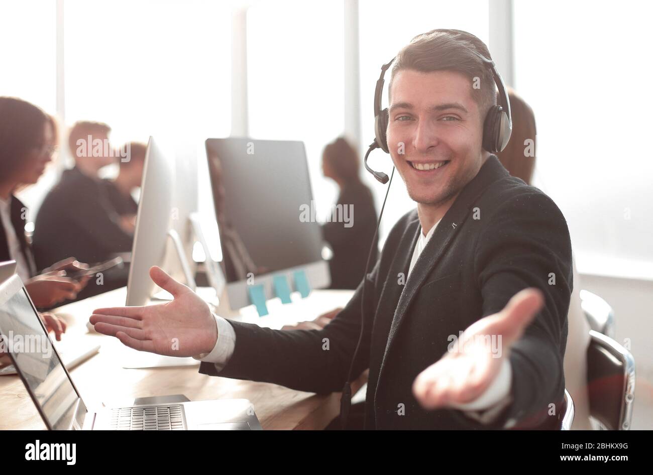call center operator holding out his hand for a handshake Stock Photo ...