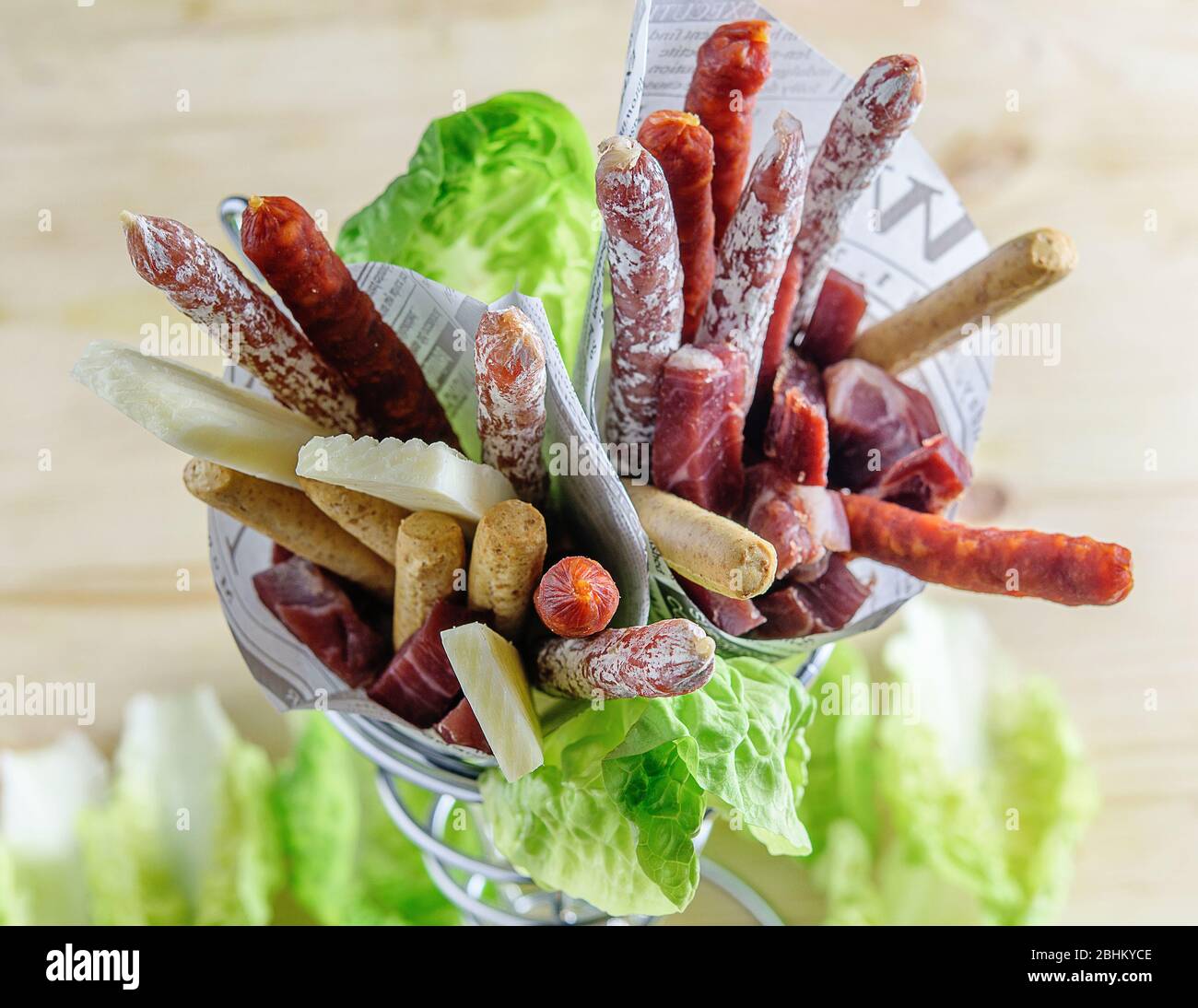 Assortment of tasty fuet and chorizo sausages, cheese and bread sticks ...