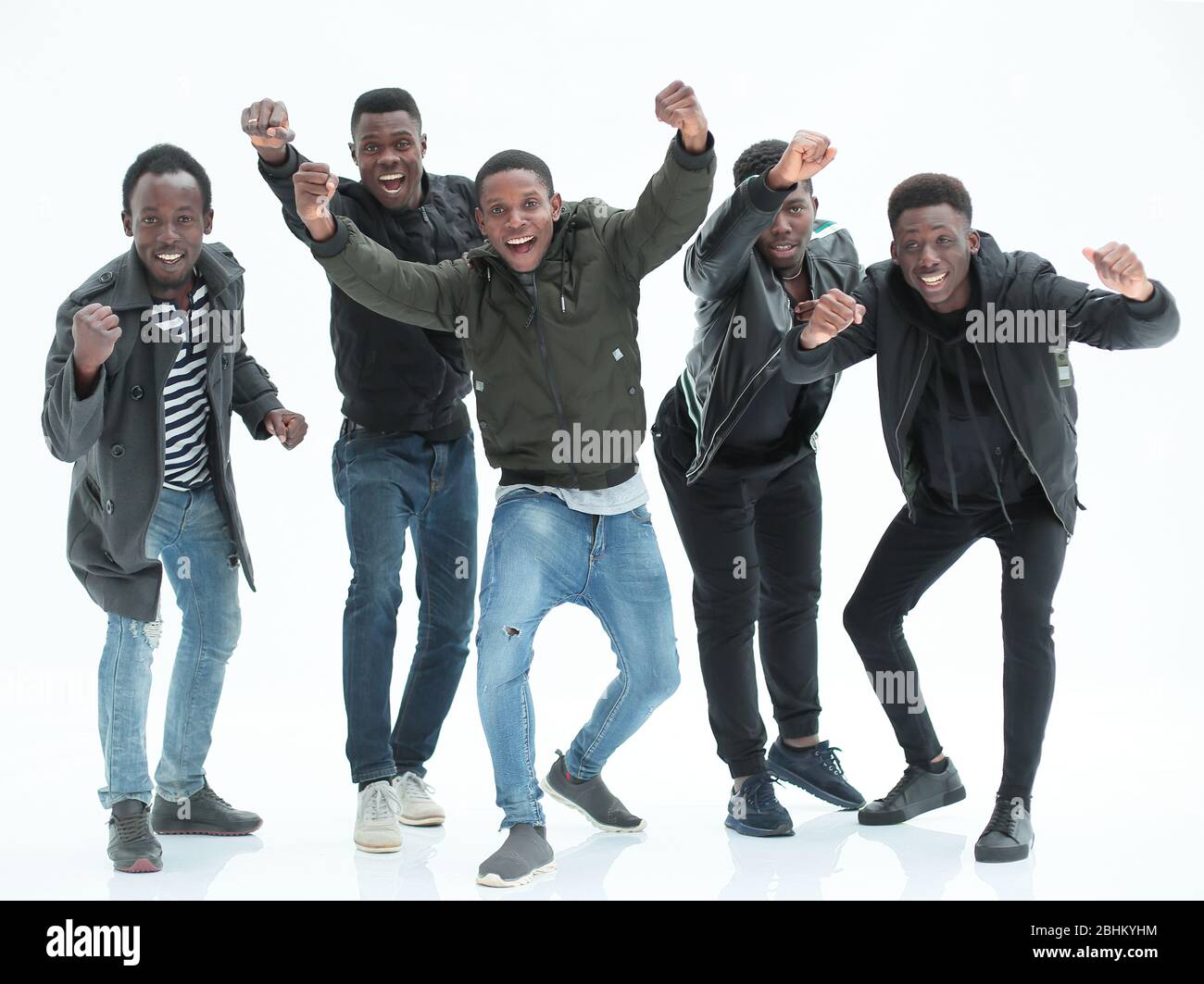 group of happy guys standing with hands up . isolated on white Stock ...