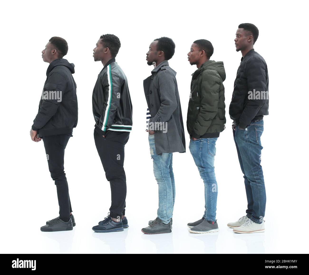 group of diverse guys standing in turns . isolated on white Stock Photo ...