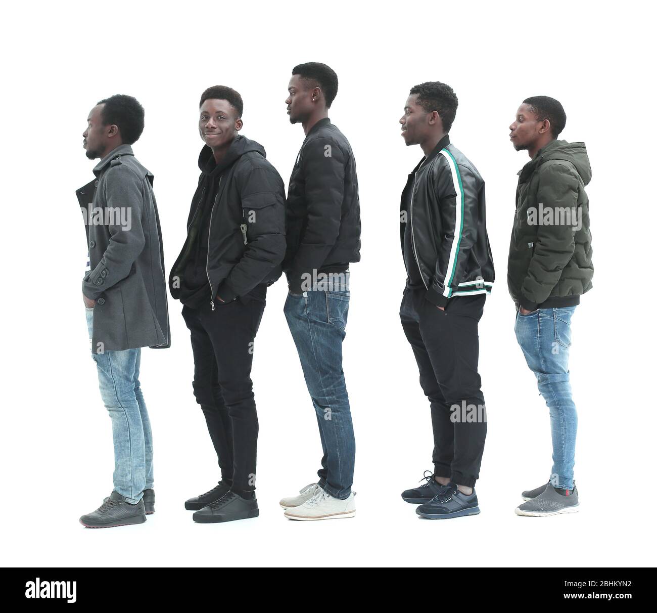 group of diverse guys standing in turns . isolated on white Stock Photo ...