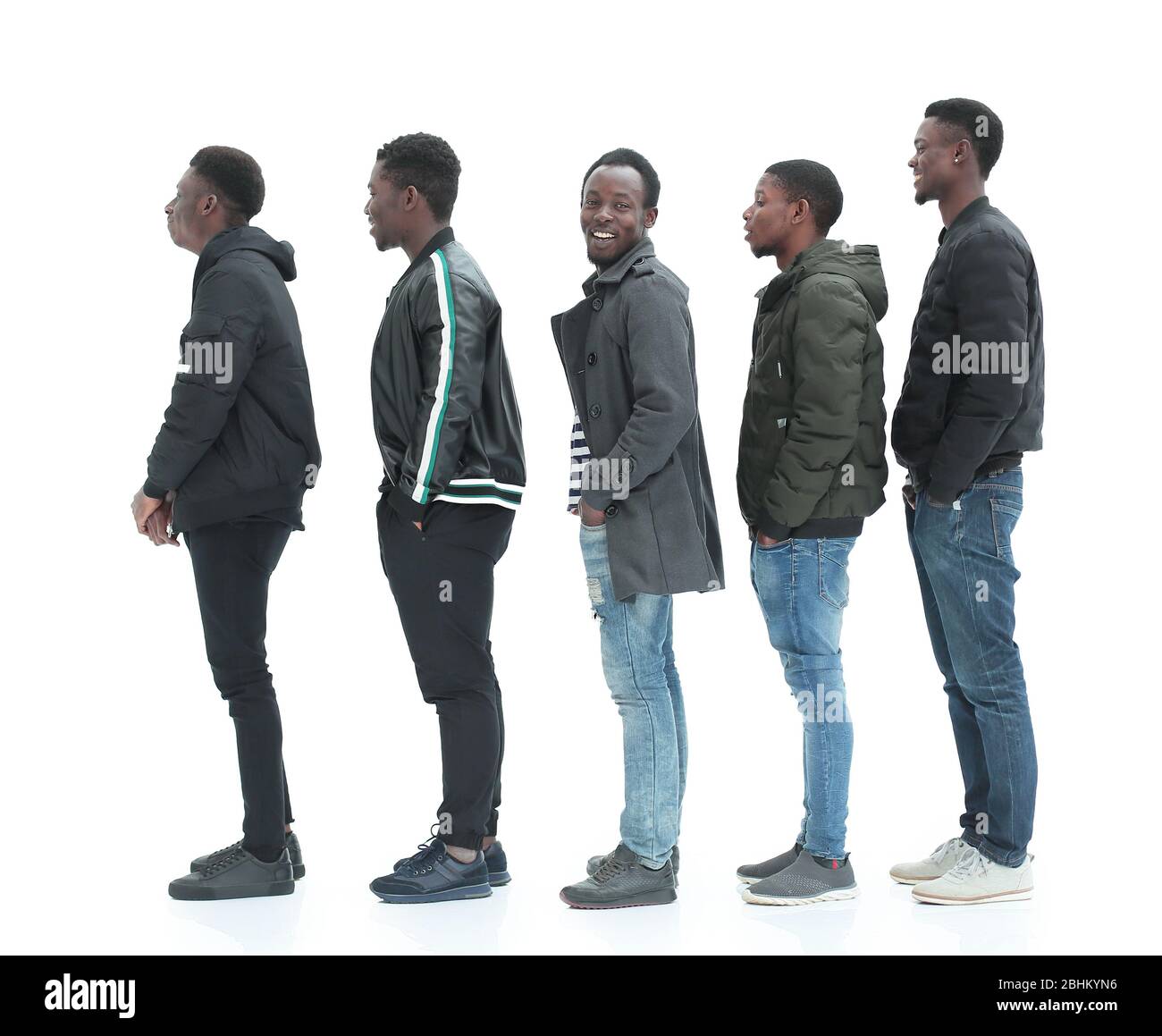 group of diverse guys standing in turns . isolated on white Stock Photo ...