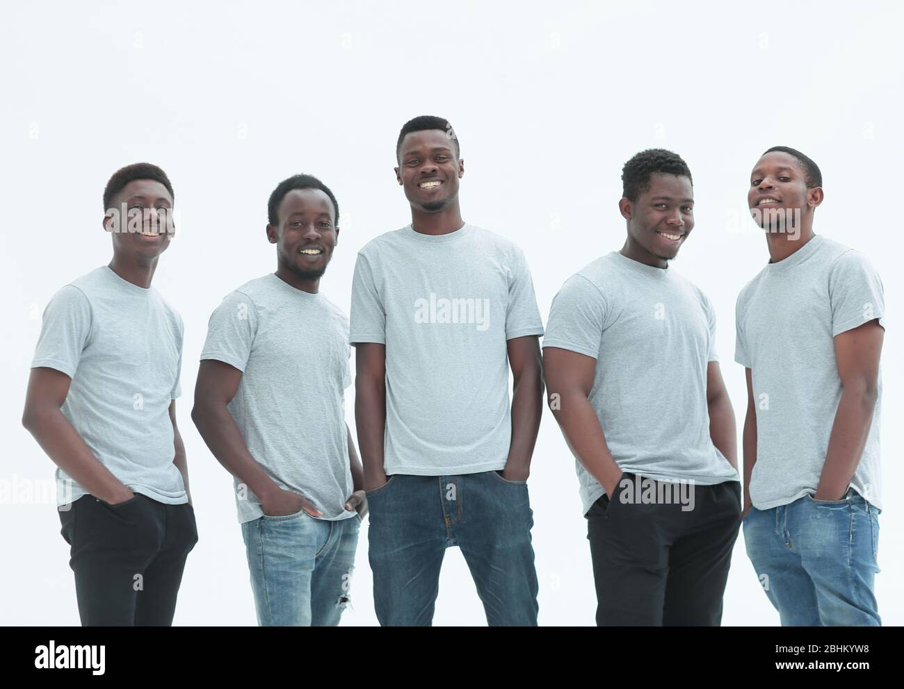 group of smiling guys standing together. isolated on white Stock Photo ...