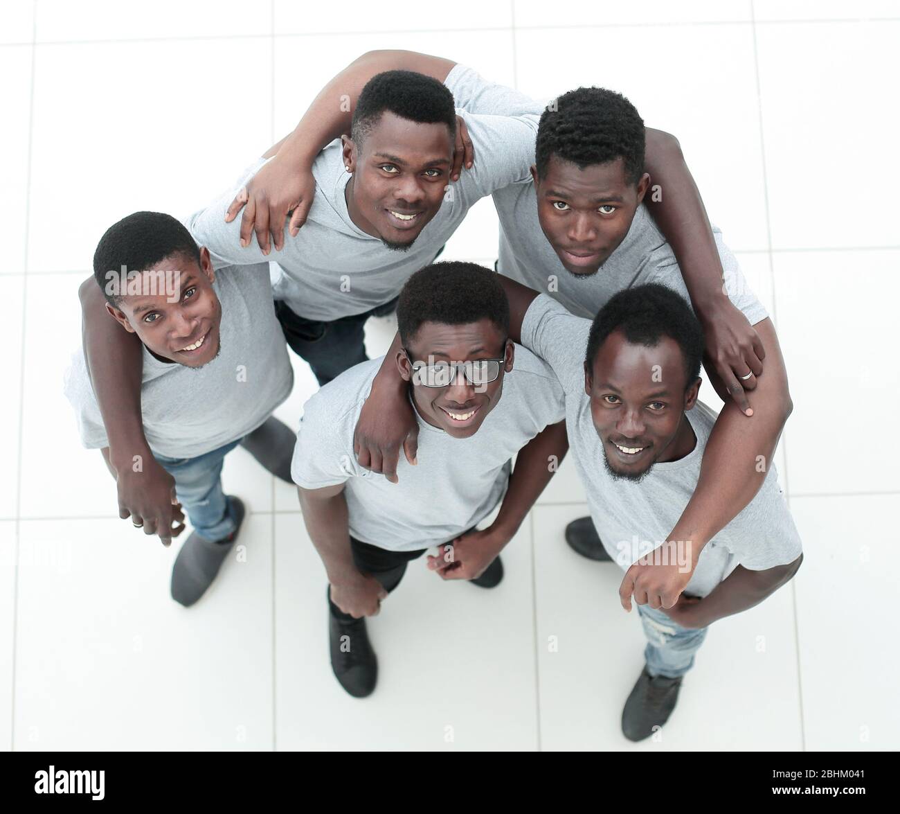 top view. group of smiling friends looking at the camera Stock Photo ...