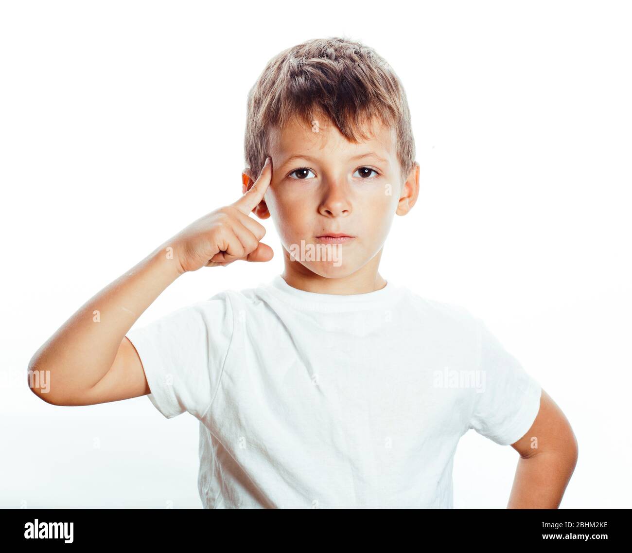 young pretty little boy wondering face gesturing, pointing isolated on ...