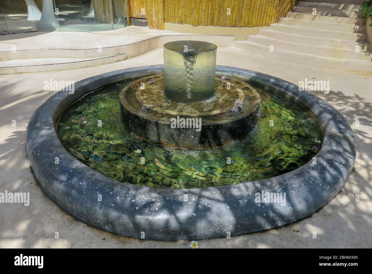 Beautiful Ornamental water fountain on the sand outside the entrance to ...