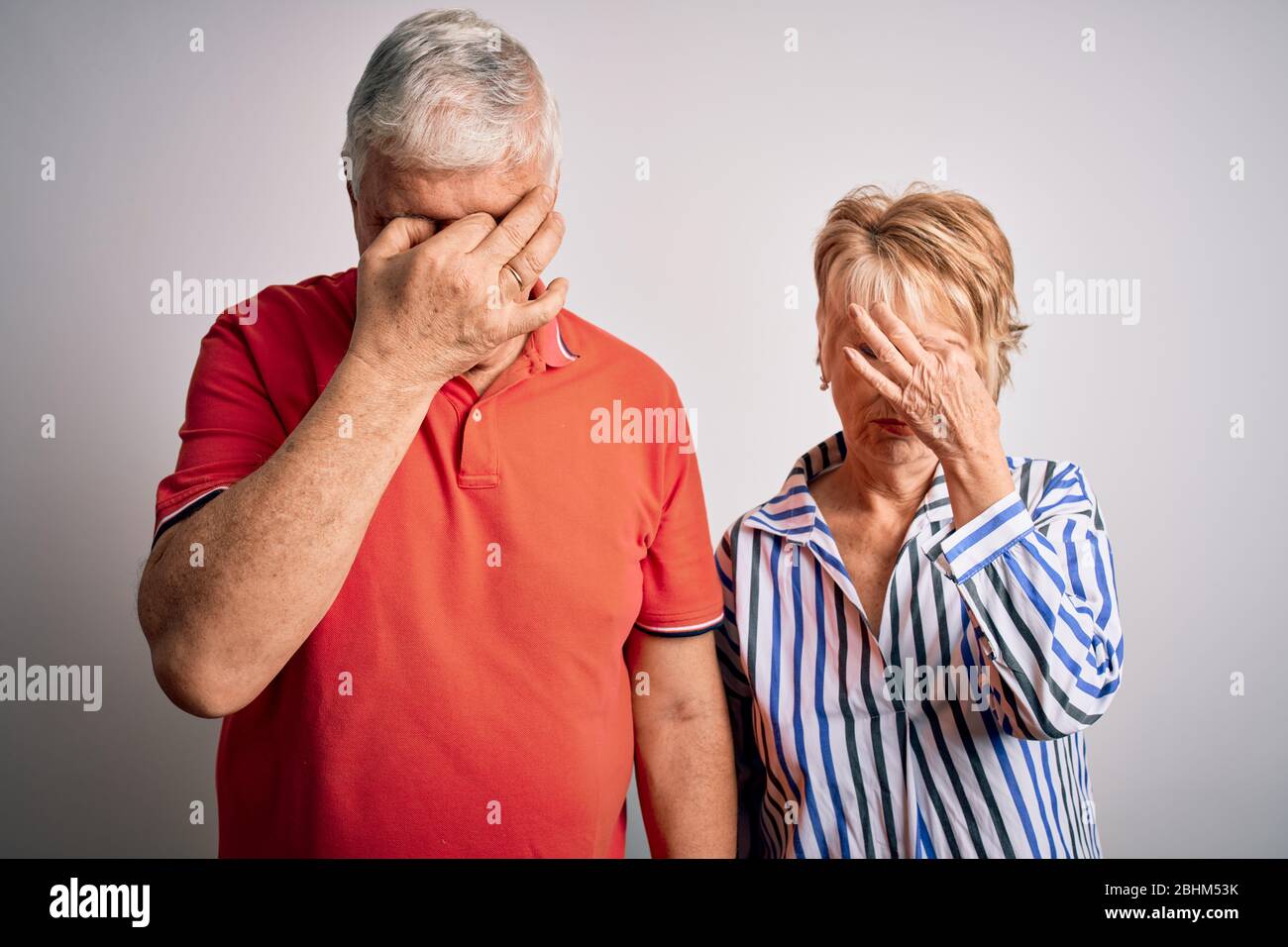 Senior beautiful couple standing together over isolated white ...