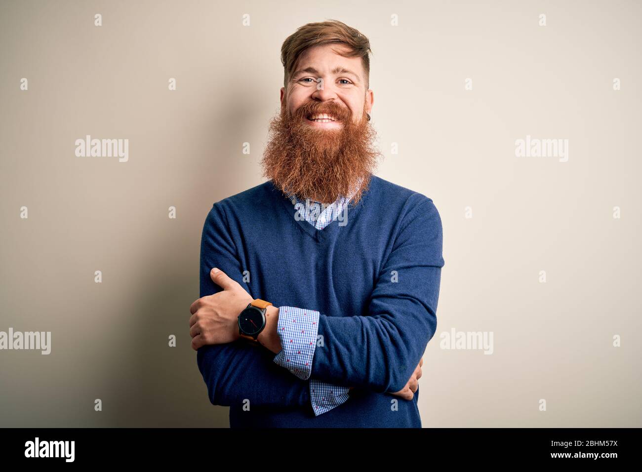 Handsome Irish redhead business man with beard standing over isolated ...