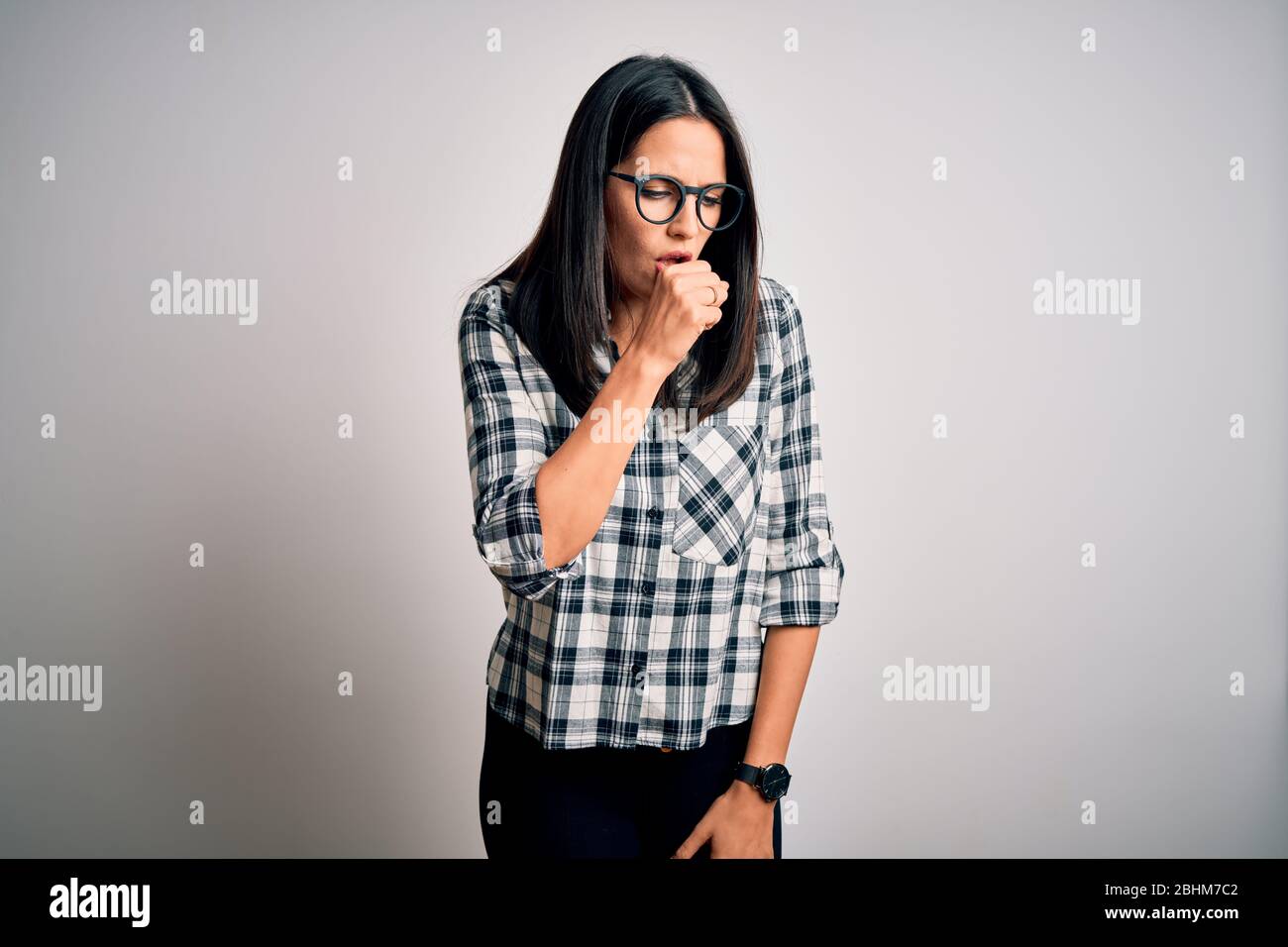 Young brunette woman with blue eyes wearing casual shirt and glasses ...