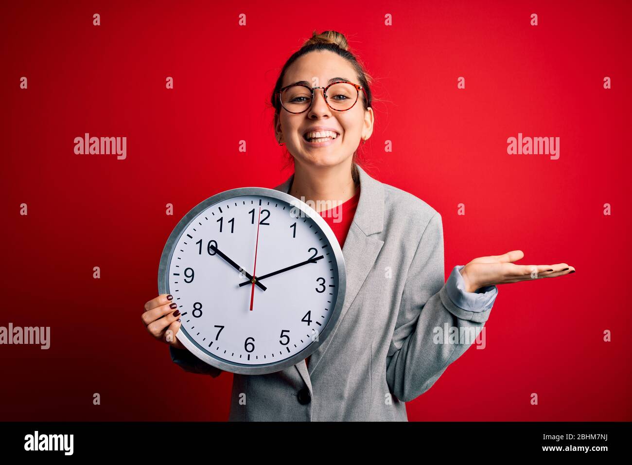 Beautiful blonde woman with blue eyes wearing glasses doing countdown ...