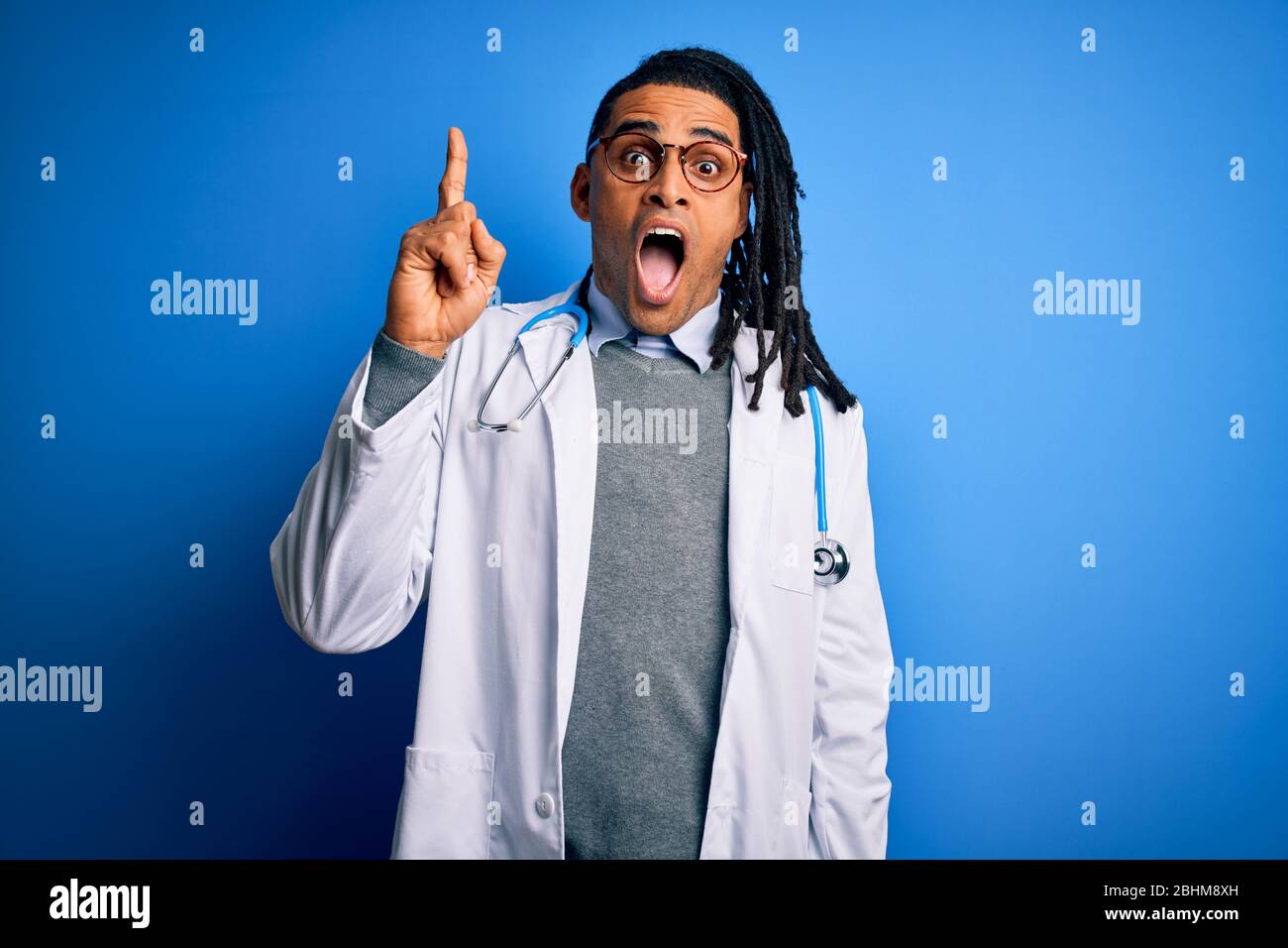 Young african american doctor man with dreadlocks wearing stethoscope ...