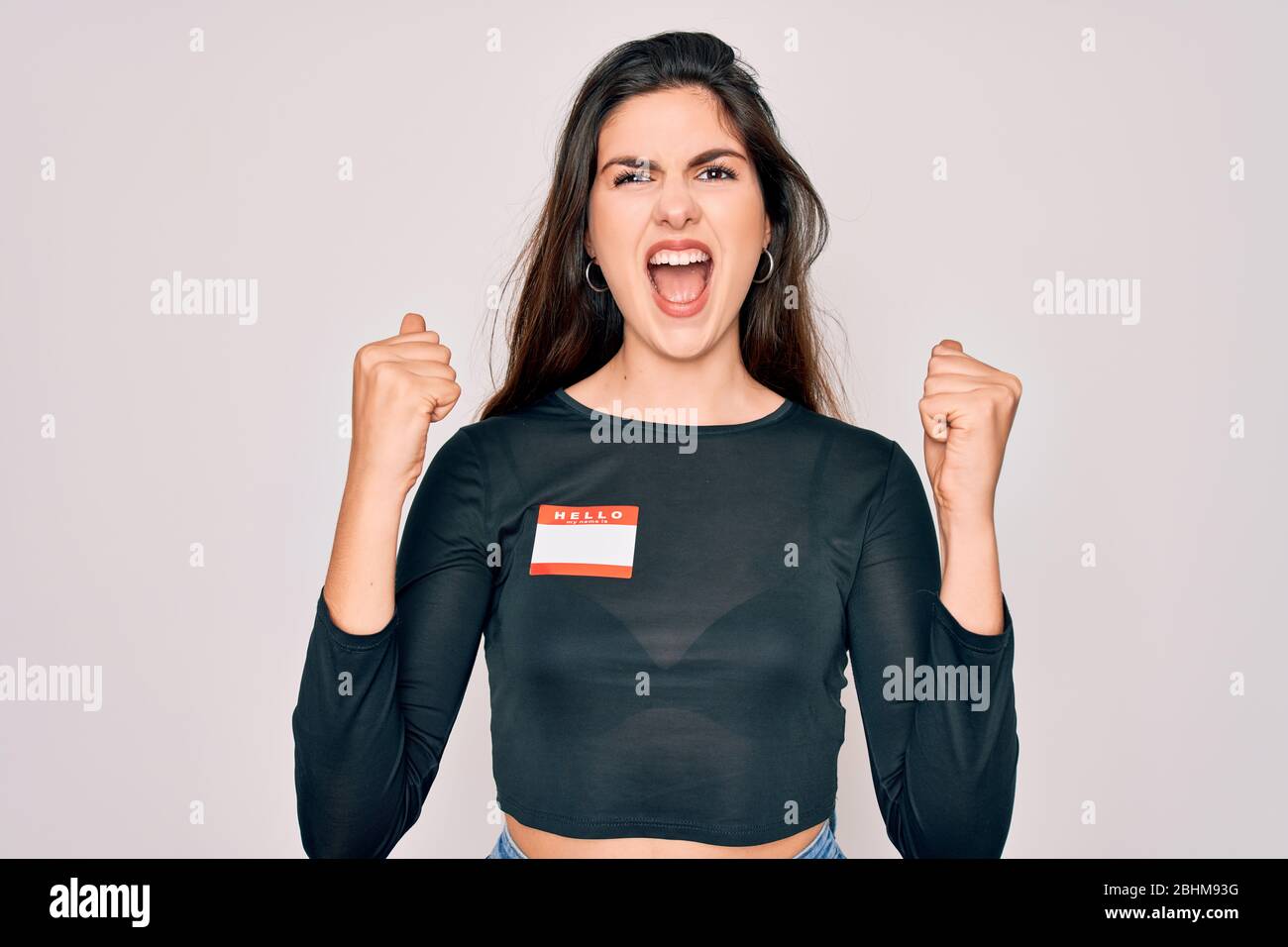 Young beautiful girl wearing Hello my name is sticker over isolated ...