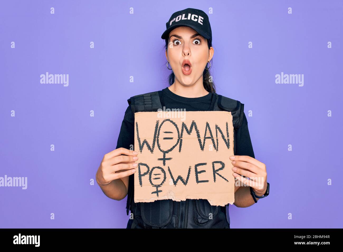 Police woman wearing security bulletproof vest uniform holding woman ...