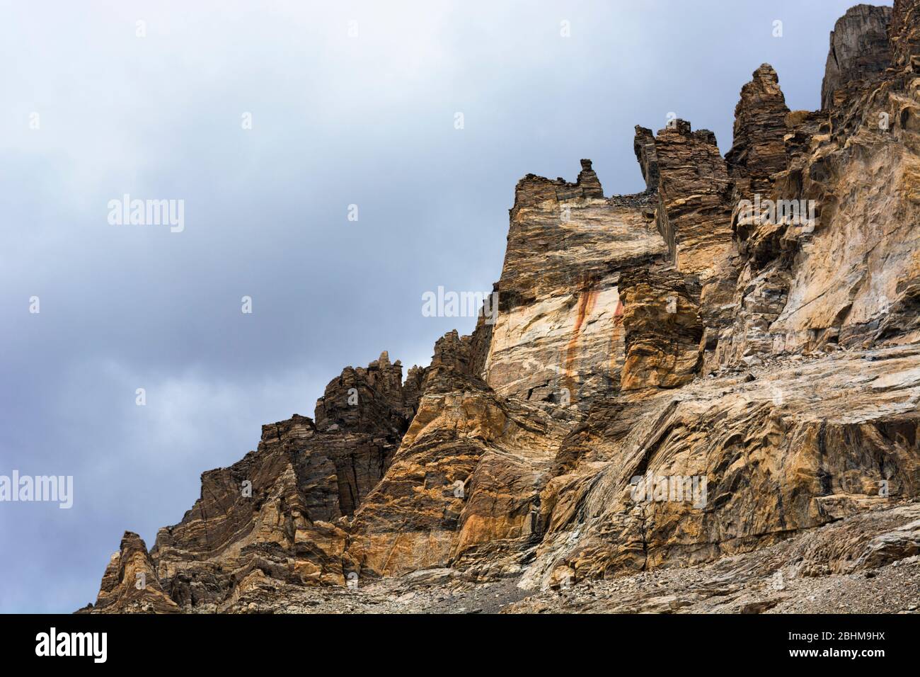 The huge rocky cliffs that flank the glacial valley at the feet of Mt ...
