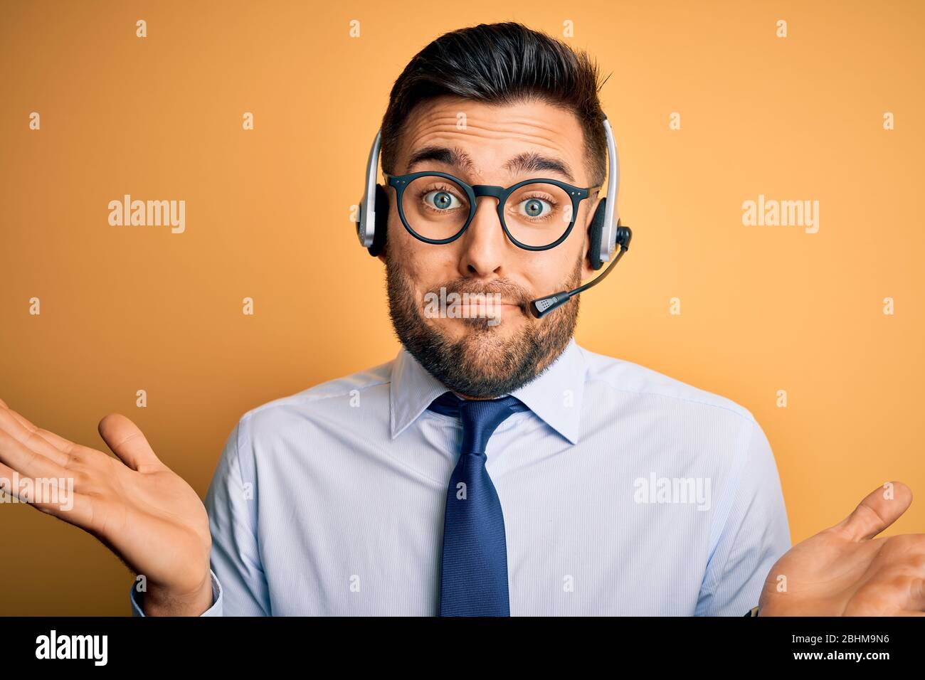 Young business operator man wearing customer service headset from call ...