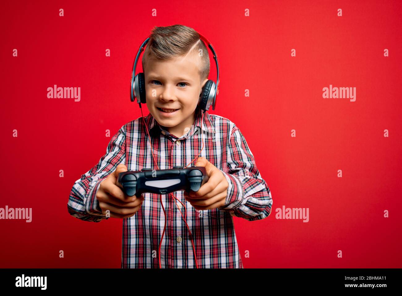 Adorable blond gamer toddler smiling happy and confident. Standing with ...