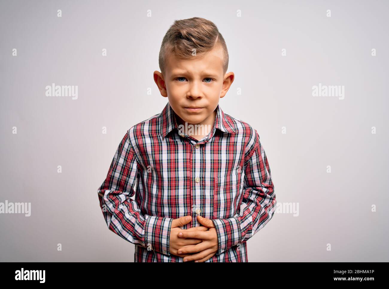 Young little caucasian kid with blue eyes wearing elegant shirt ...