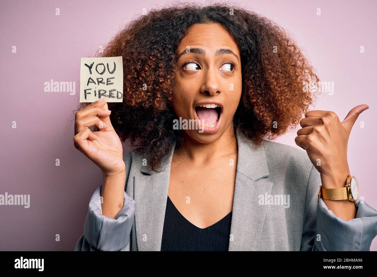 Young african american woman with afro hair holding paper with you are ...