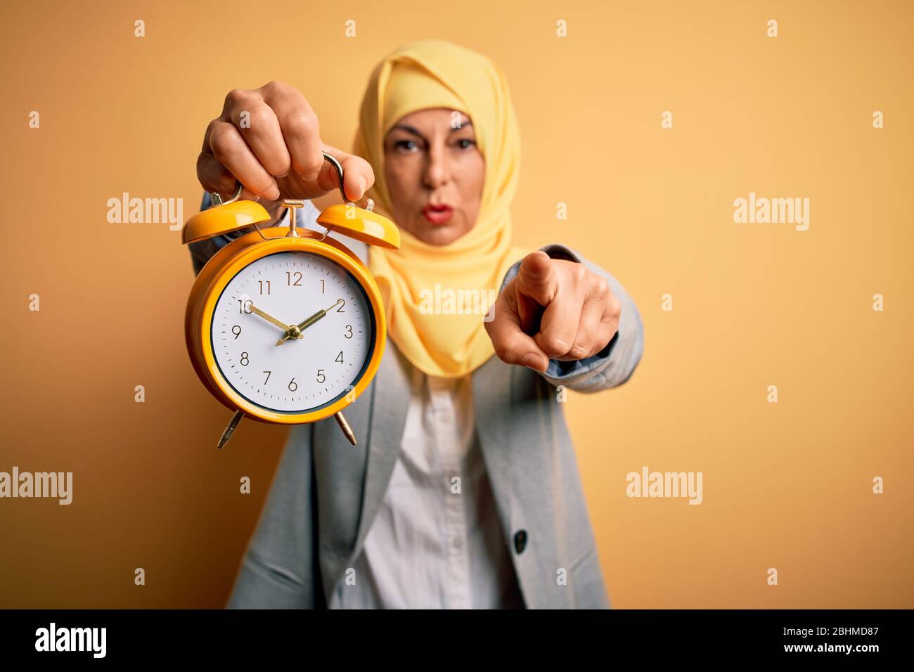 Middle age brunette business woman wearing muslim traditional hijab ...