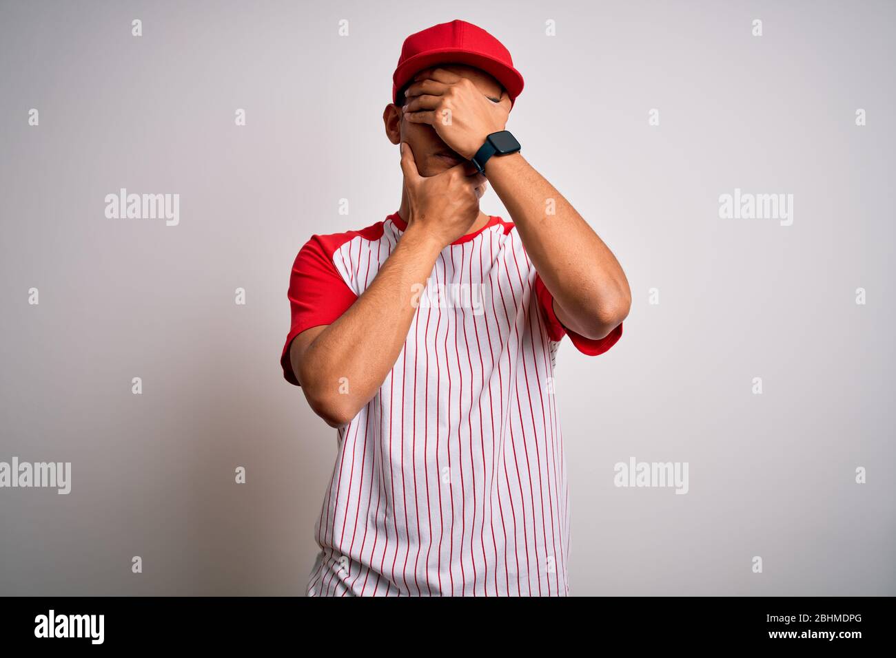 Young handsome african american sportsman wearing striped baseball t ...