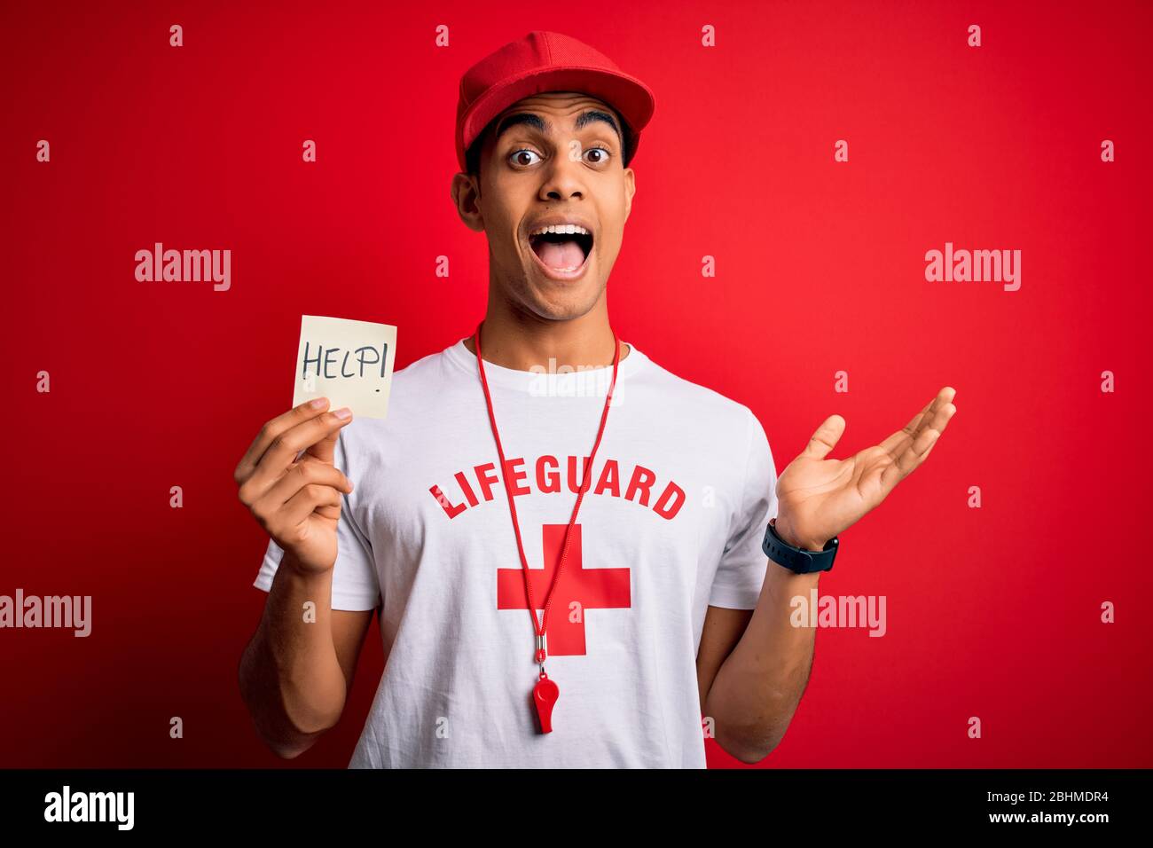 Young handsome african american lifeguard man wearing whistle holding ...