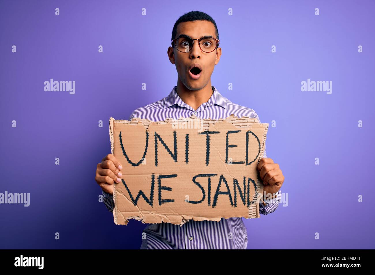 African american activist man asking for union holding banner with ...