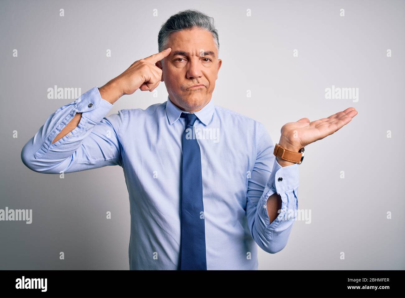 Middle age handsome grey-haired business man wearing elegant shirt and ...