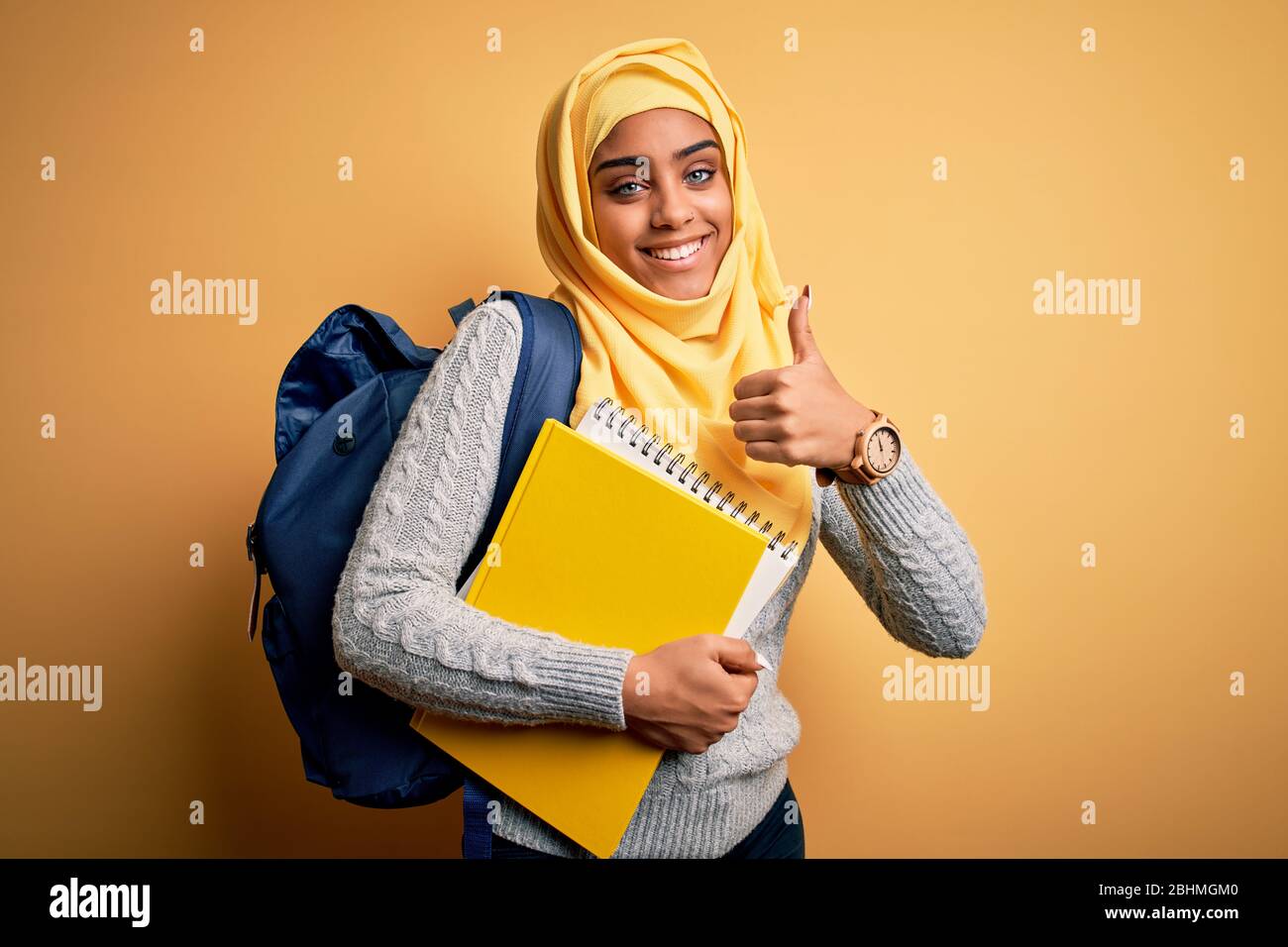 Young african american student girl wearing muslim hijab and backpack ...