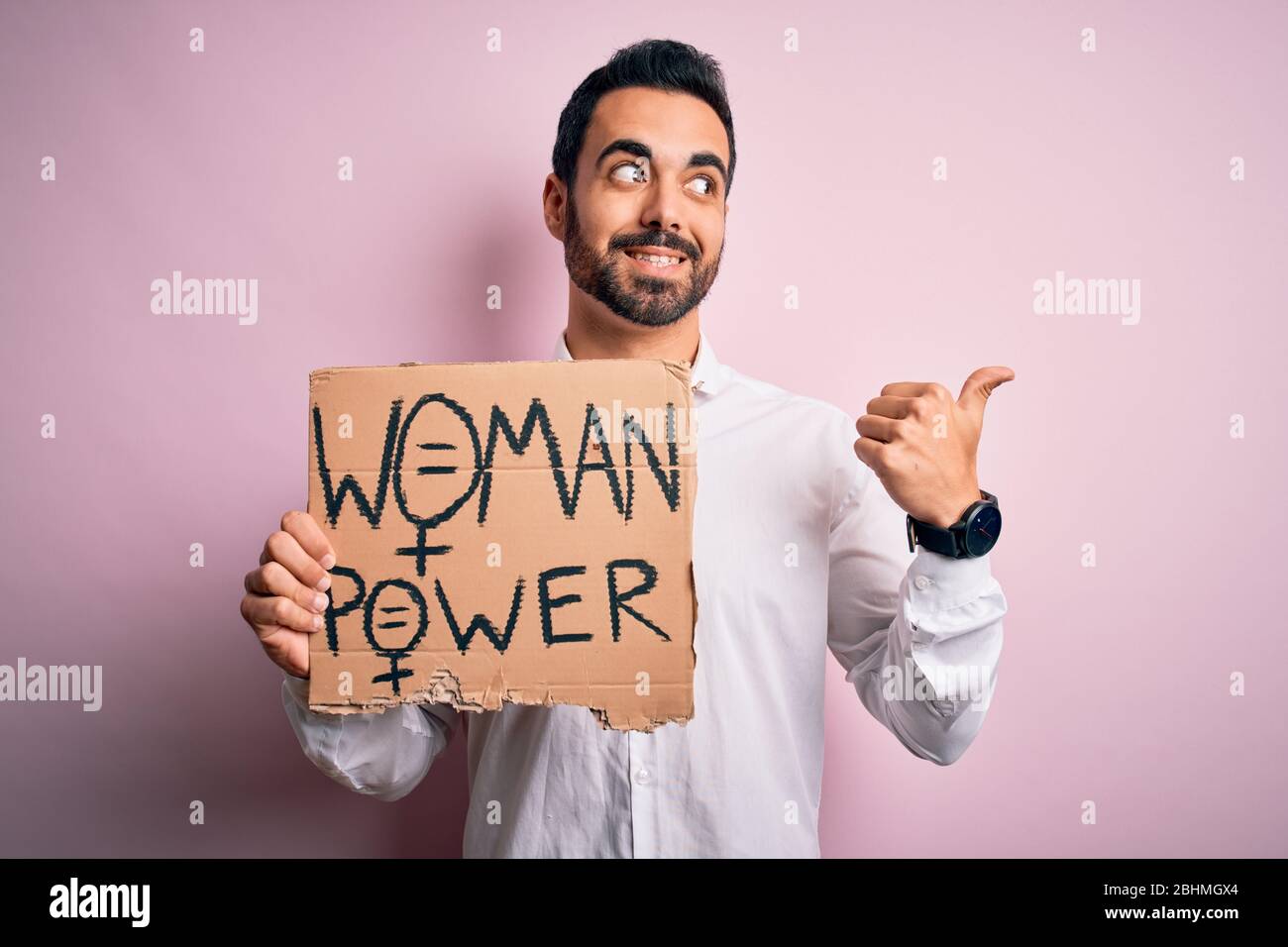 Activist man with beard asking for women rights holding banner with ...