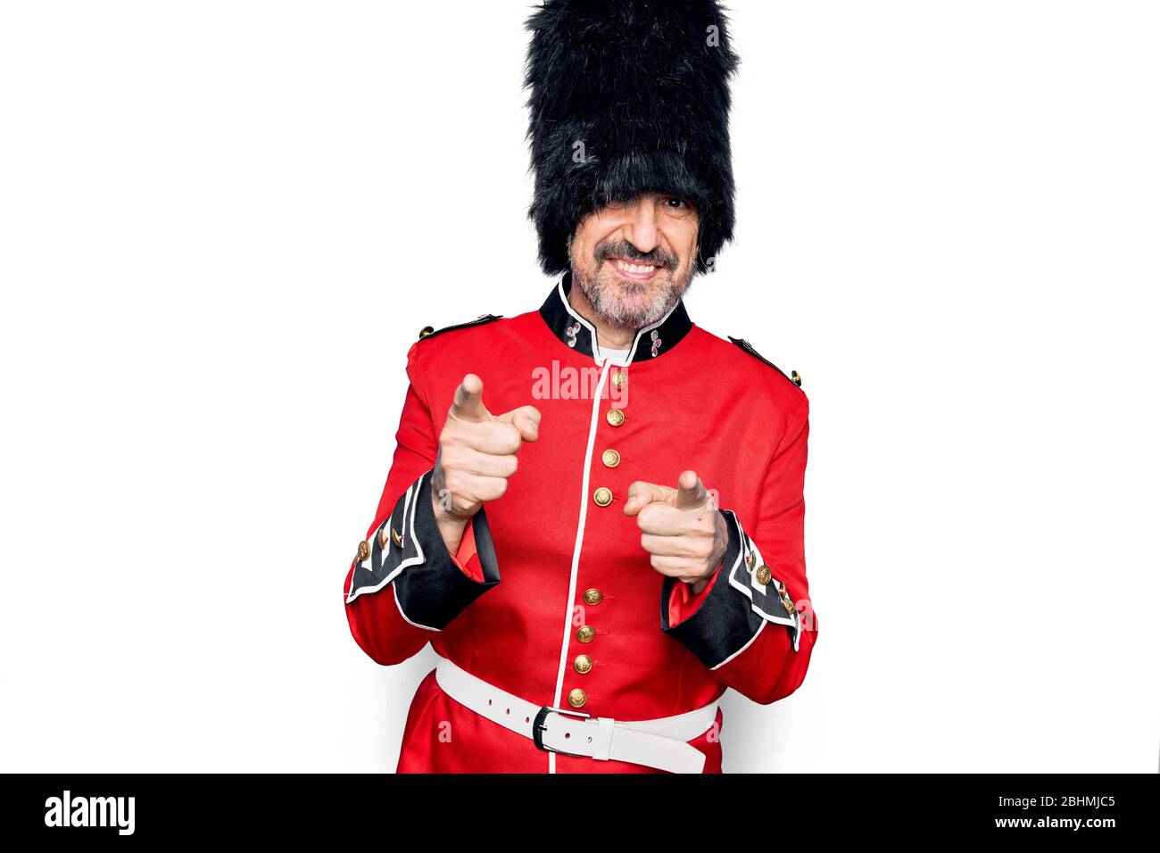 Middle age handsome wales guard man wearing traditional uniform over ...
