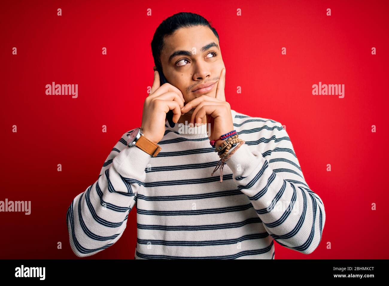 Brazilian man having conversation talking on the smartphone over ...