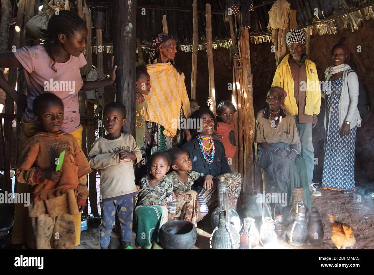 Tribal Family inside their Hut Stock Photo - Alamy