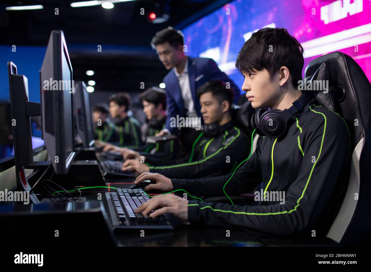 Young Chinese men playing esports Stock Photo - Alamy