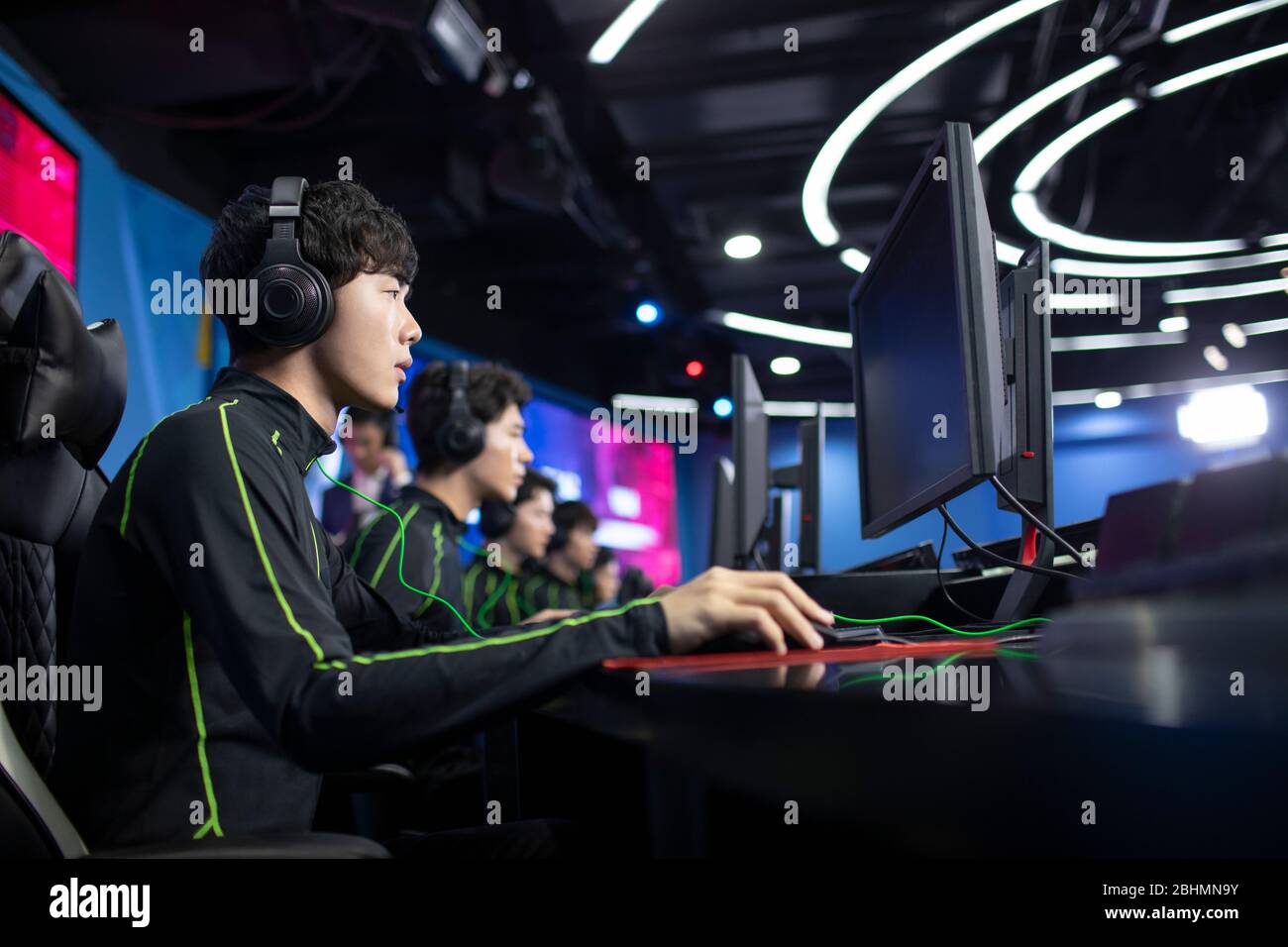 Young Chinese men playing esports Stock Photo - Alamy