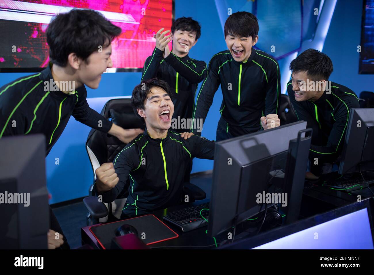 Young Chinese men playing esports Stock Photo - Alamy