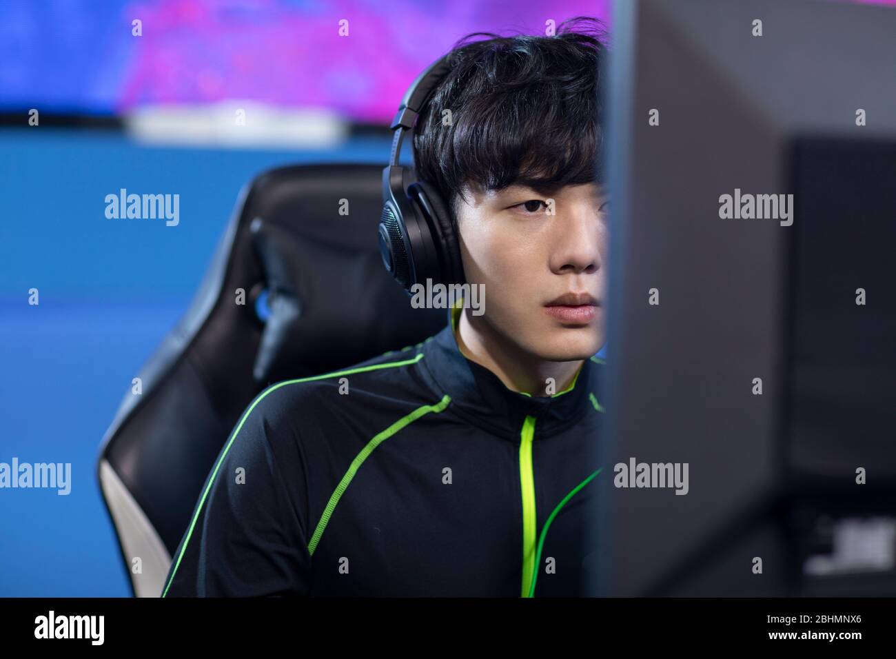 Young Chinese man playing esports Stock Photo - Alamy
