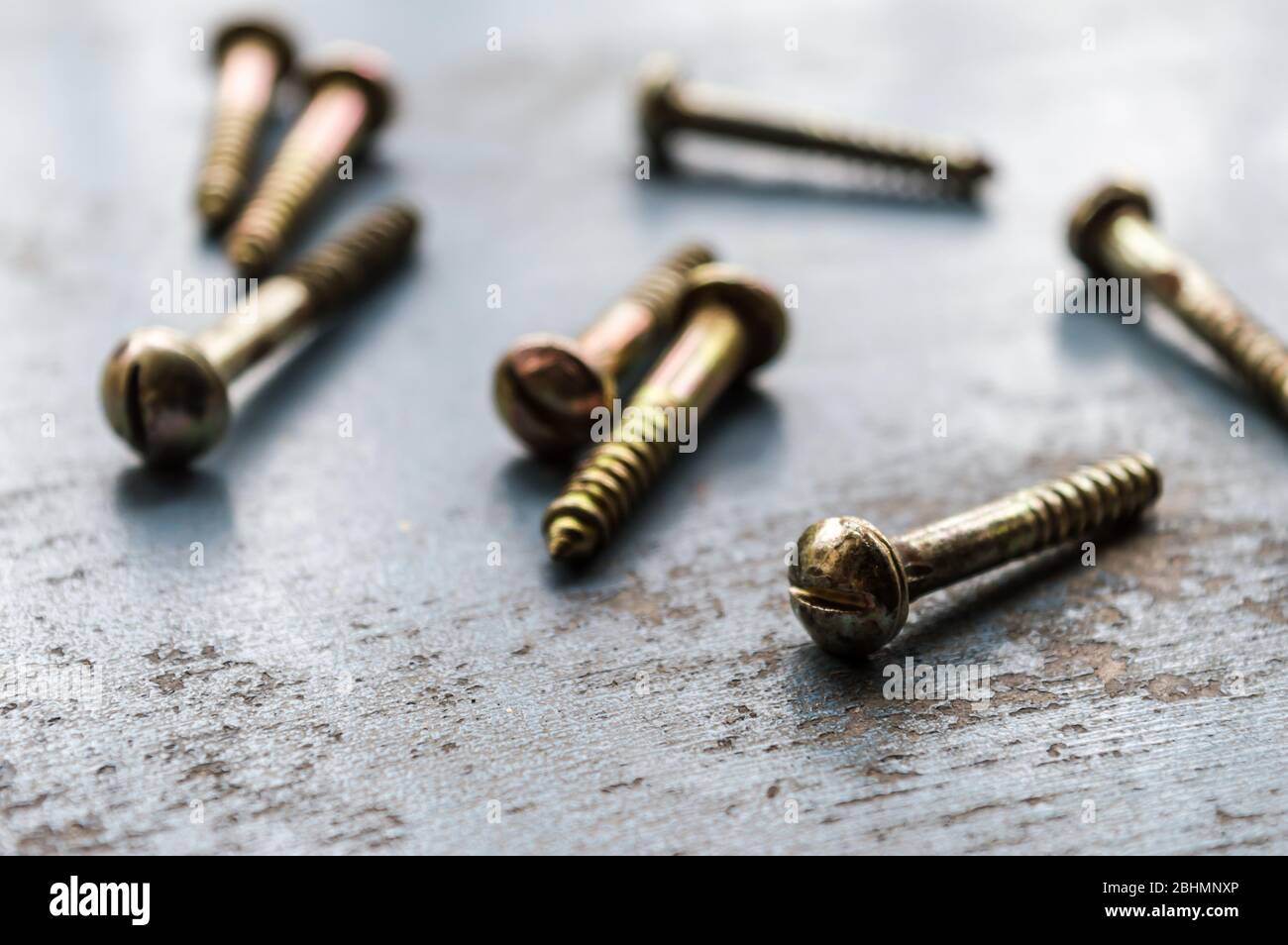Screw on rusty metallic surface. Close Up. Screws Industrial Background ...
