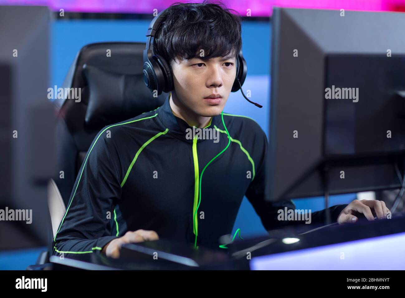 Young Chinese man playing esports Stock Photo - Alamy