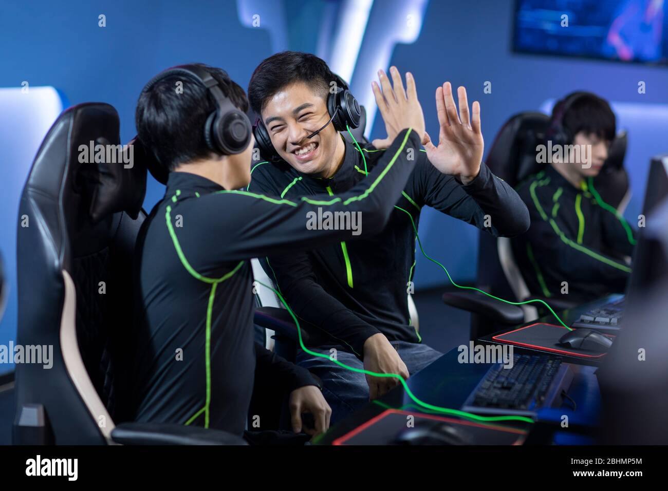 Young Chinese men playing esports Stock Photo - Alamy