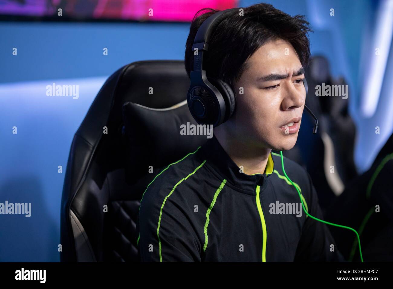 Young Chinese man playing esports Stock Photo - Alamy