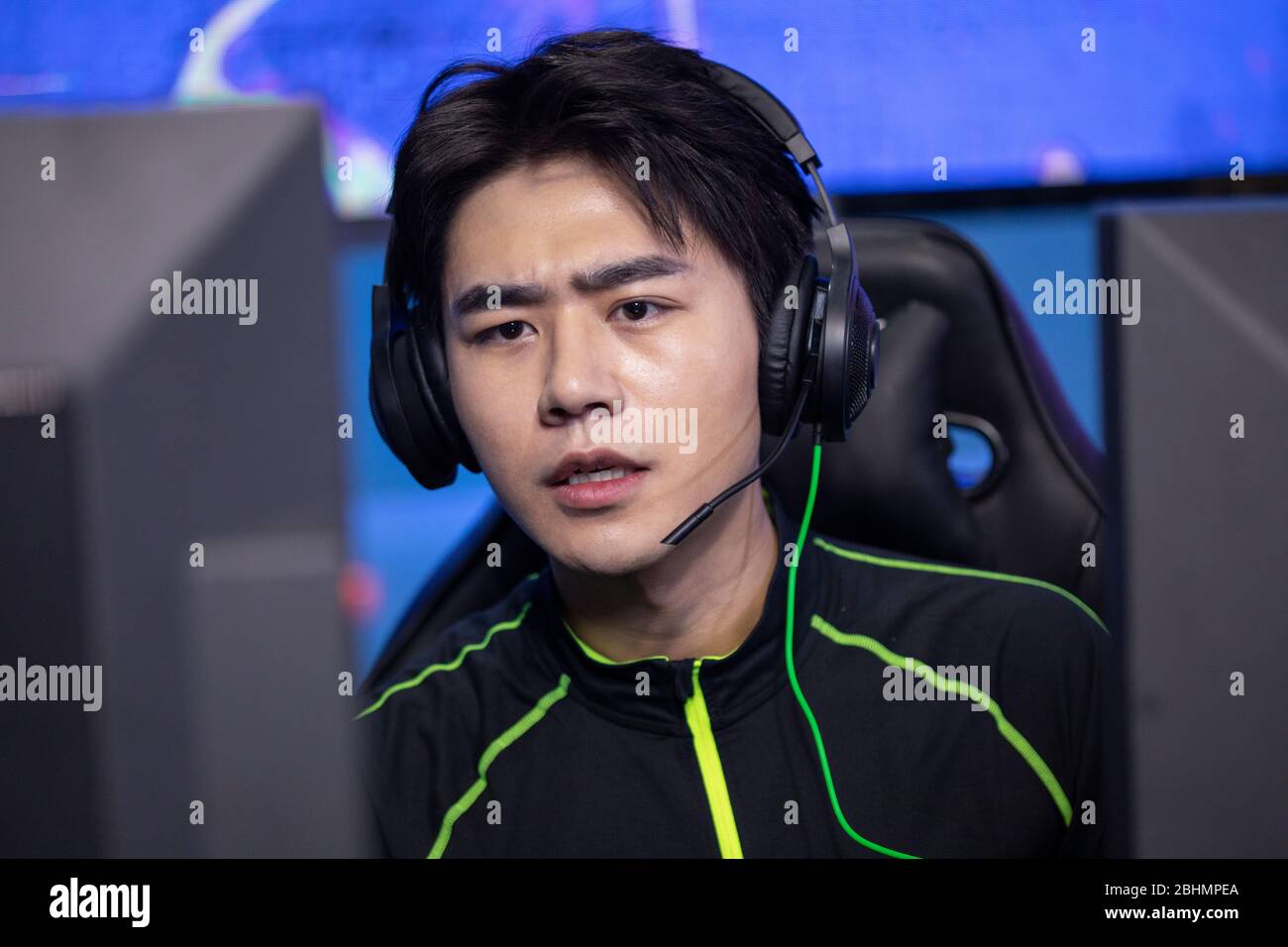Young Chinese man playing esports Stock Photo - Alamy