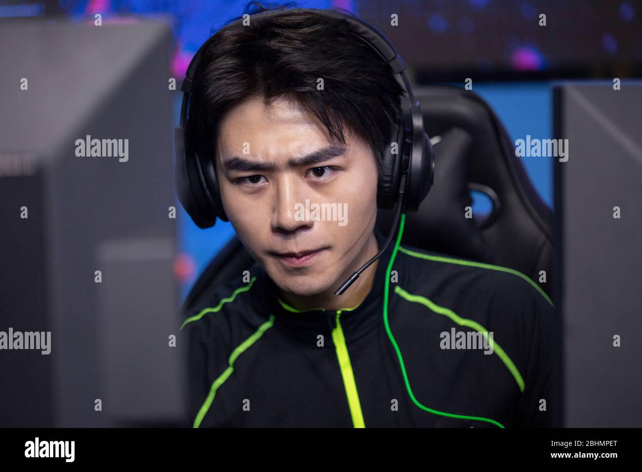 Young Chinese man playing esports Stock Photo - Alamy