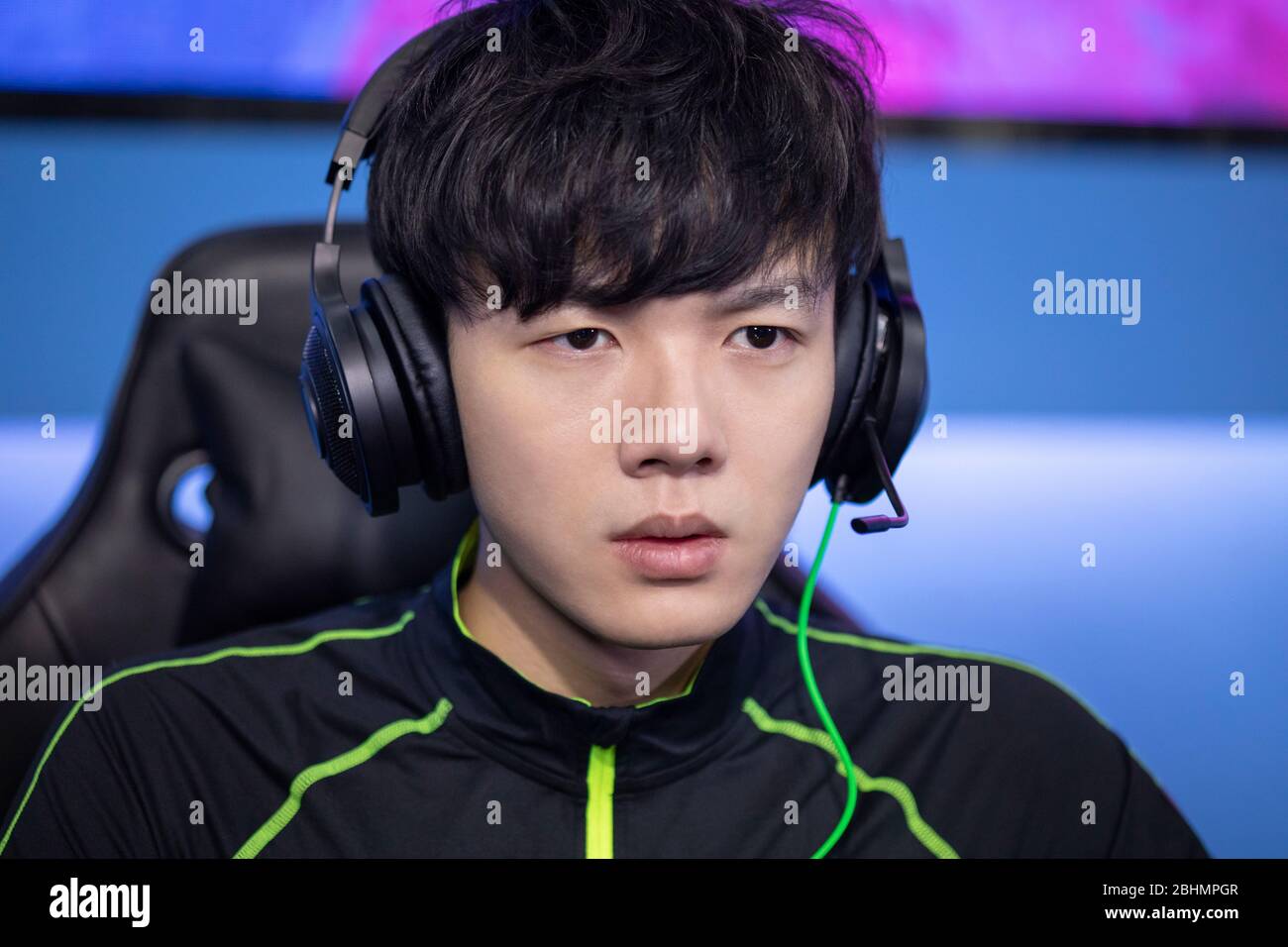 Young Chinese man playing esports Stock Photo - Alamy
