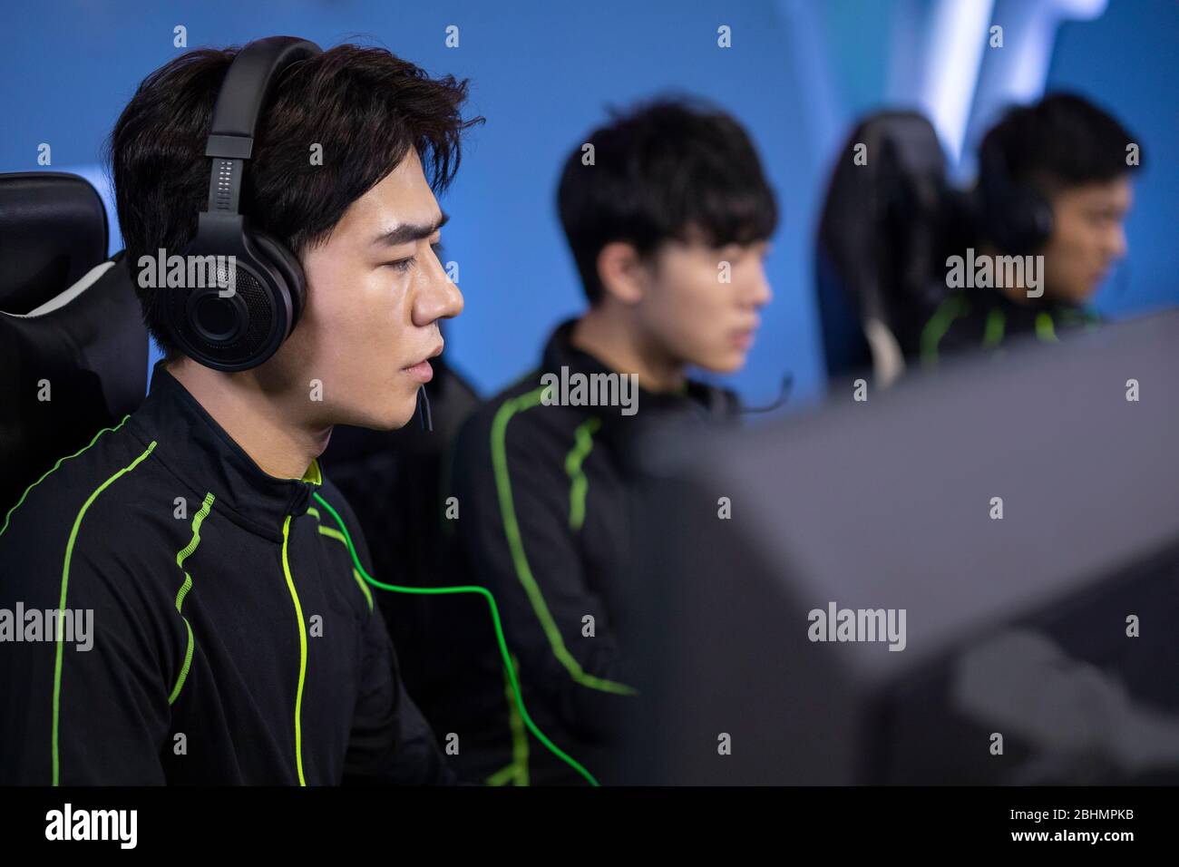 Young Chinese men playing esports Stock Photo - Alamy